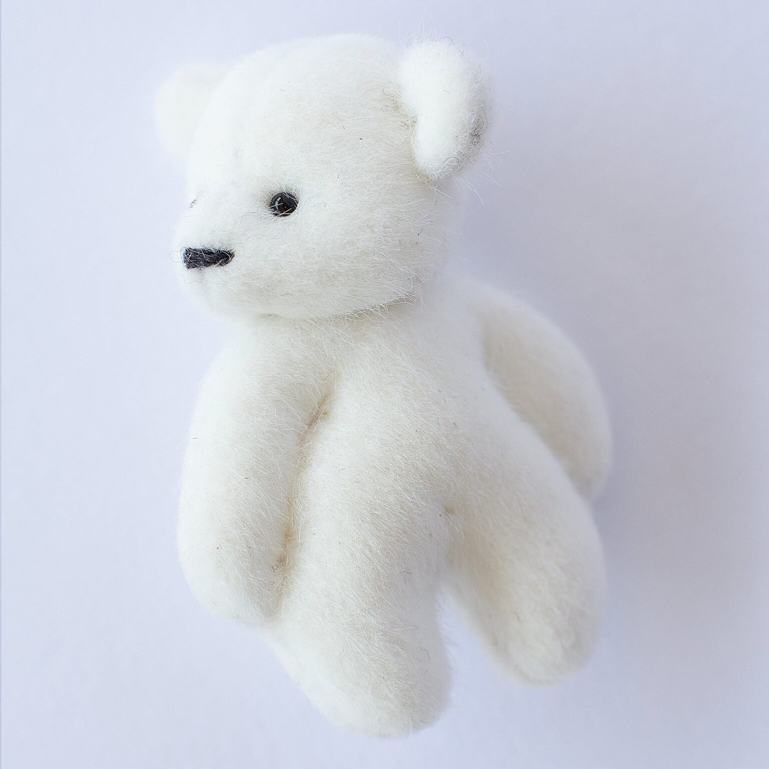 Miniature teddy bear for 1:12 dollhouses. 2″ size. Swivel head. White ...